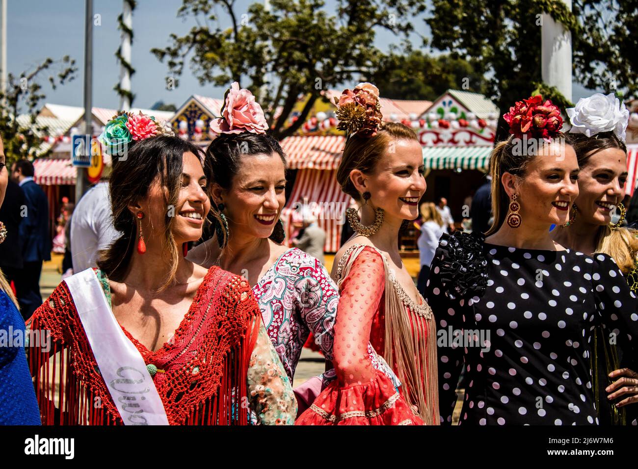 Seville, Spain - May 01, 2022 Sevillians dressed in traditional ...