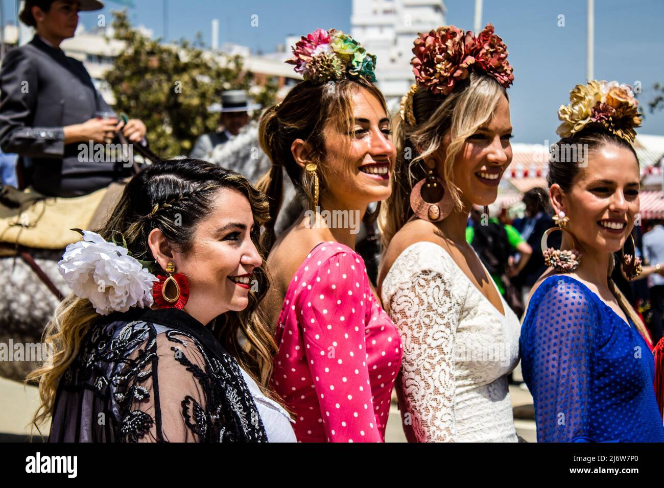 Seville, Spain - May 01, 2022 Sevillians dressed in traditional ...