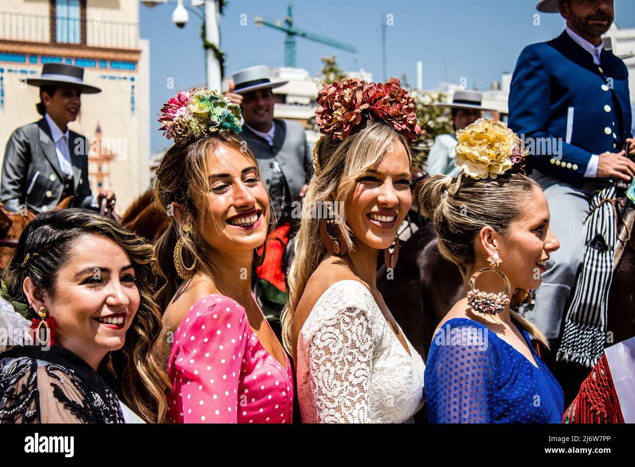 Seville, Spain - May 01, 2022 Sevillians dressed in traditional ...