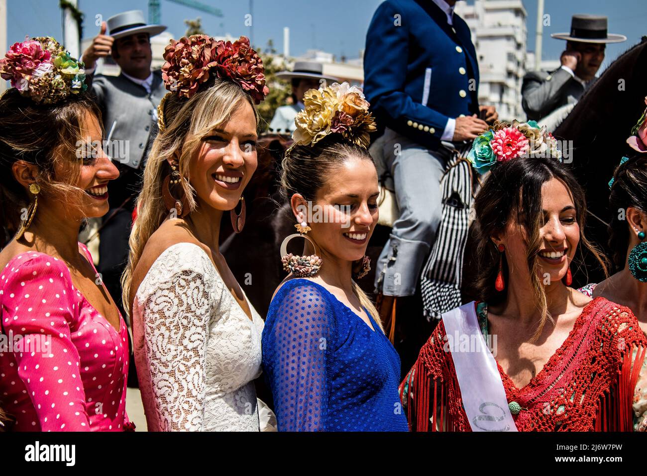 Seville, Spain - May 01, 2022 Sevillians dressed in traditional ...
