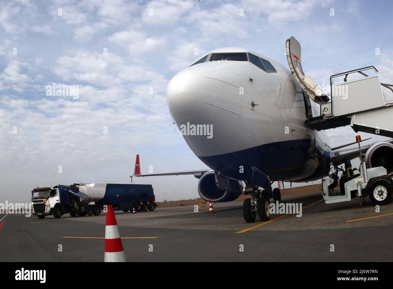 Aviation concept - aircraft fueling - gasoline refueler and passenger ...