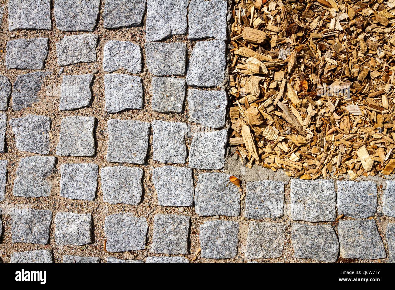 Gray granite blocks with wood chips textures background Stock Photo - Alamy
