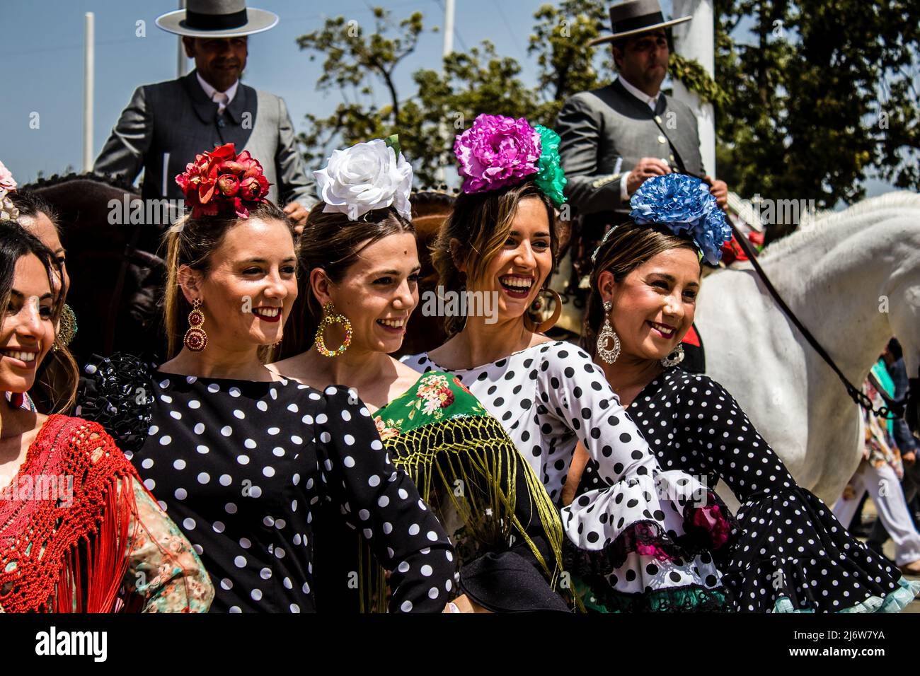 Seville, Spain - May 01, 2022 Sevillians dressed in traditional ...