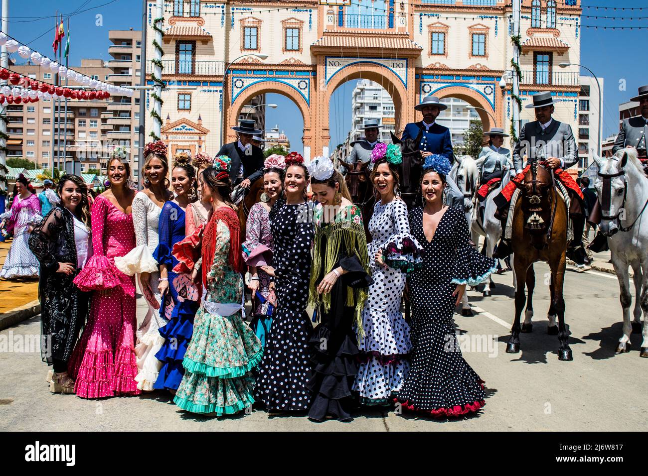 Seville, Spain - May 01, 2022 Sevillians dressed in traditional ...