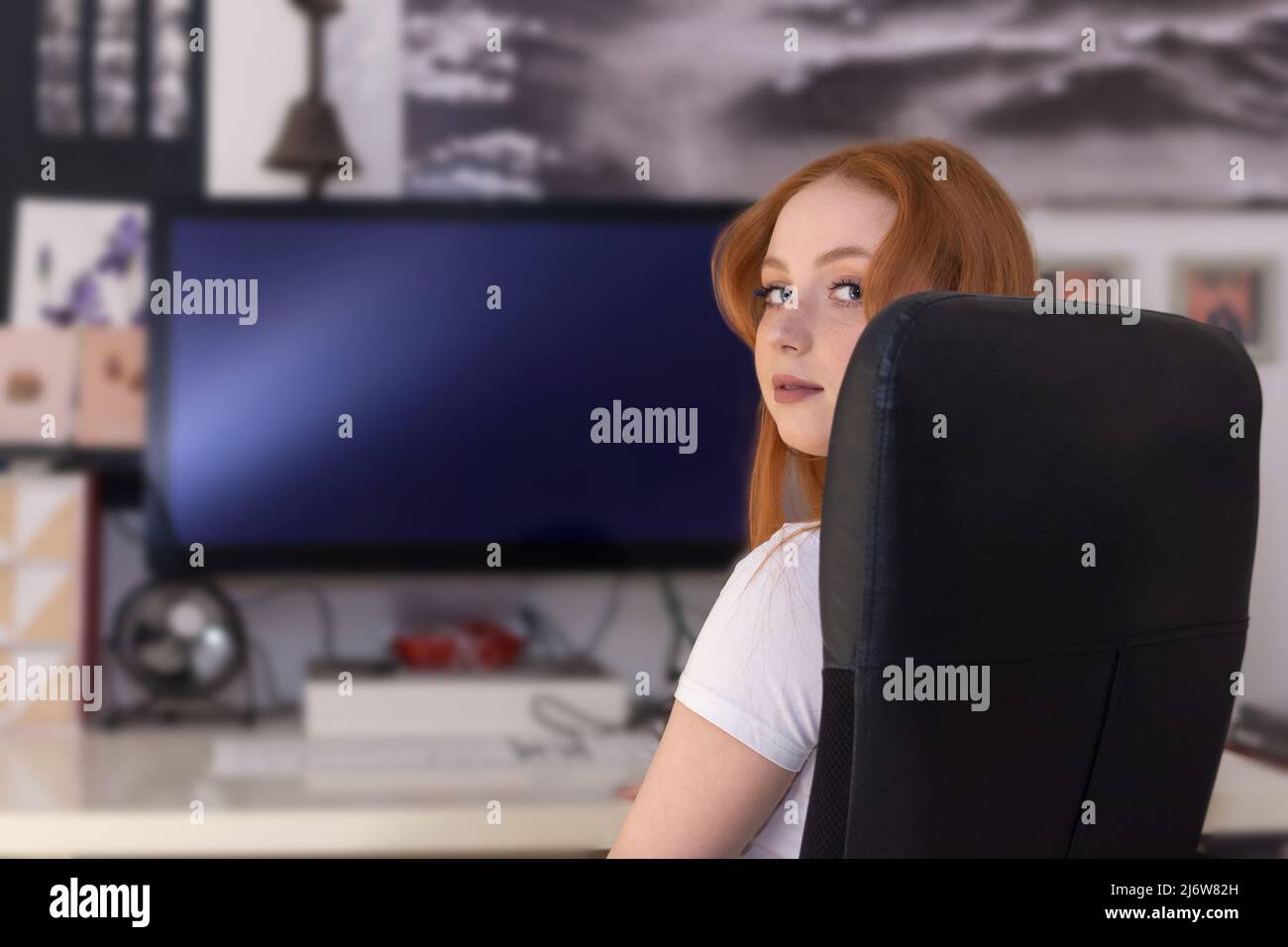 Girl sitting in a chair in front of a computer hi-res stock photography ...