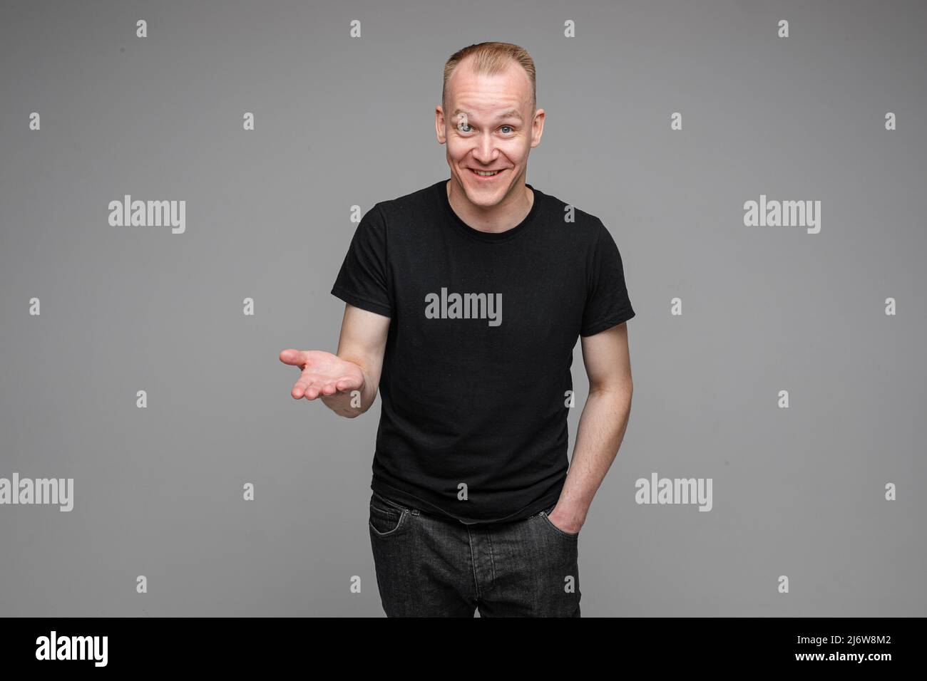 Portrait of surprised man showing hand up asking question. Isolate on ...