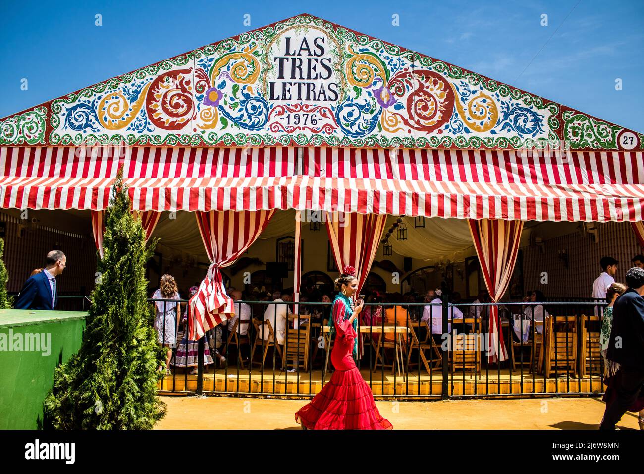 Seville, Spain - May 01, 2022 Sevillians dressed in traditional ...