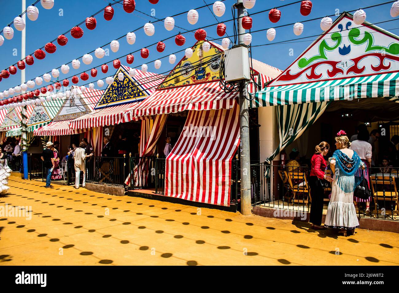 Seville, Spain - May 01, 2022 Sevillians dressed in traditional ...