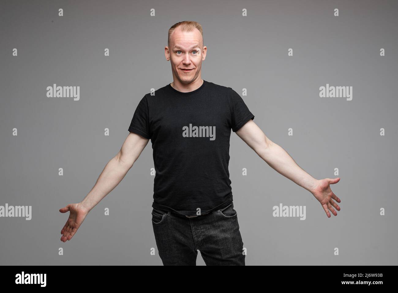 Studio portrait of handsome adult Caucasian man with short blond hair ...