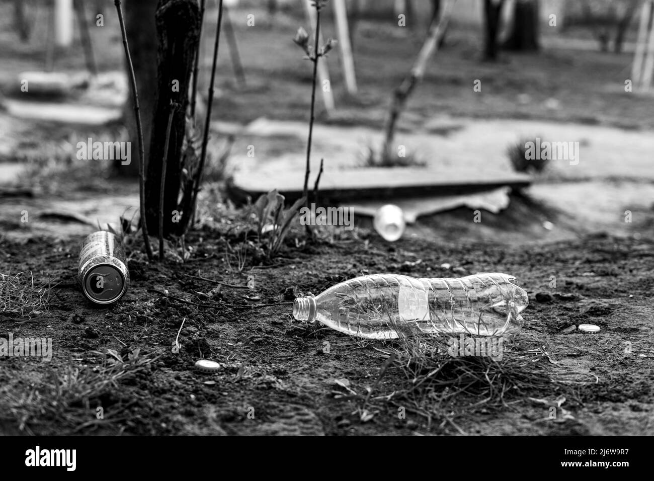 plastic bottle and garbage scattered on the street Stock Photo - Alamy
