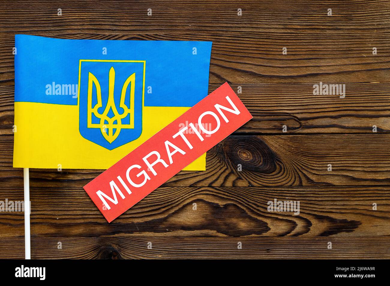 Word migration on Ukrainian flag. Ukrainian immigration concept Stock ...