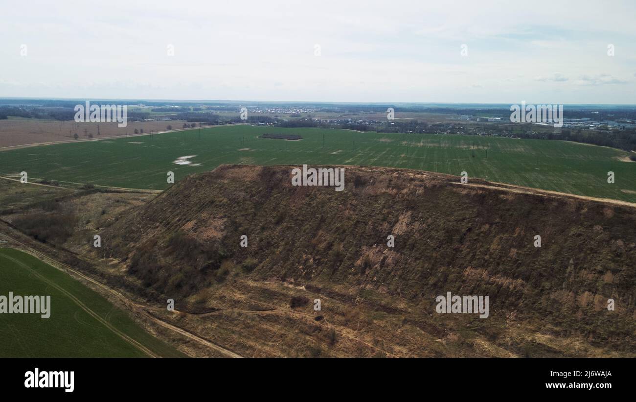 Conserved landfill for household waste. A mound of rubbish. Aerial ...