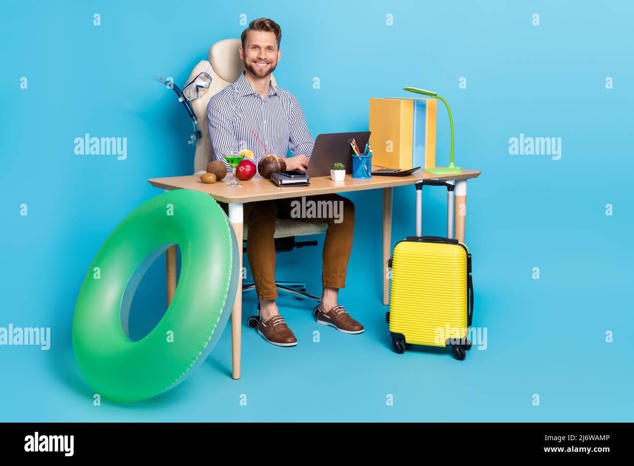 Photo of cheerful positive travel agency worker guy prepare to go on ...