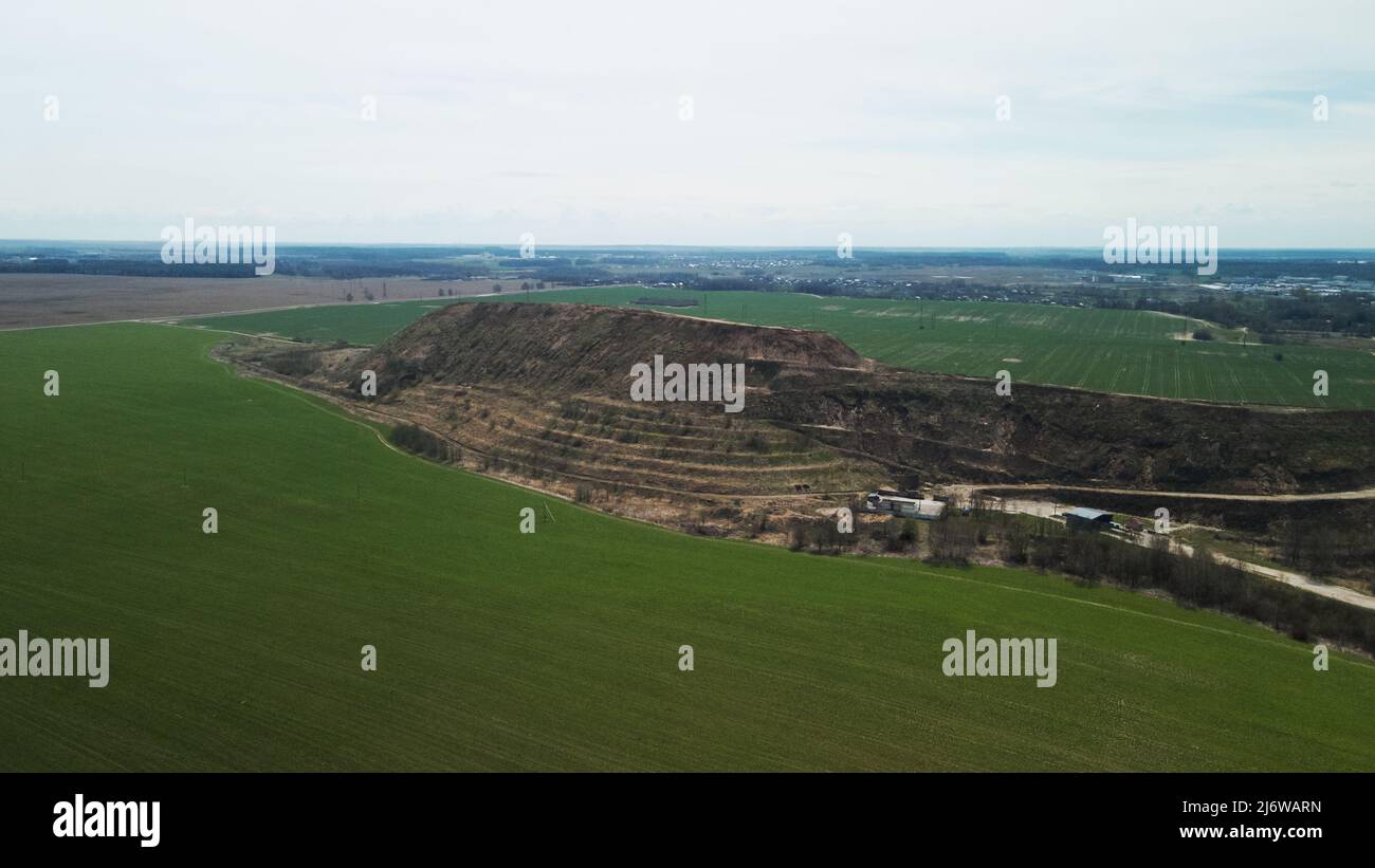Conserved landfill for household waste. A mound of rubbish. Aerial ...