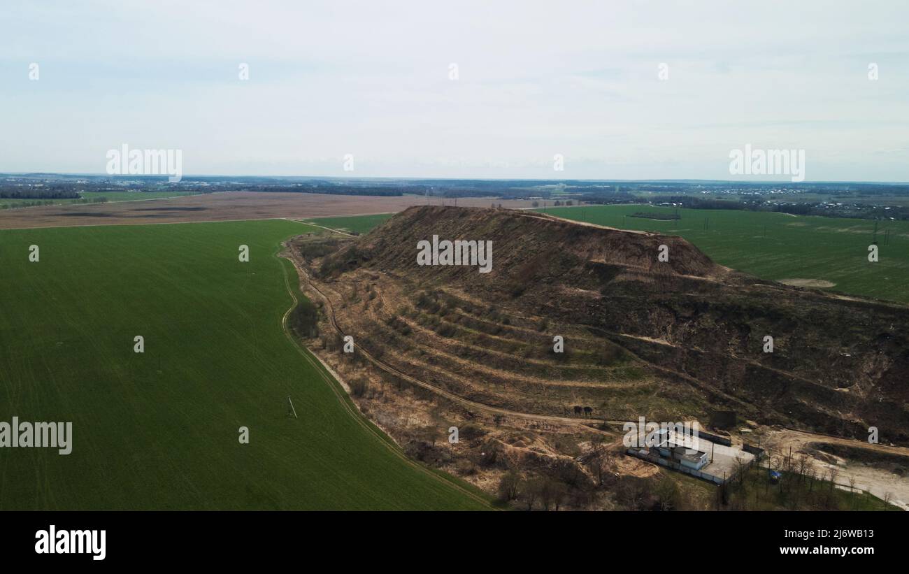 Conserved landfill for household waste. A mound of rubbish. Aerial ...