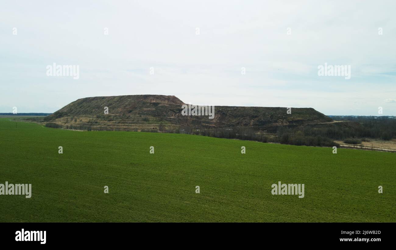 Conserved landfill for household waste. A mound of rubbish. Aerial ...