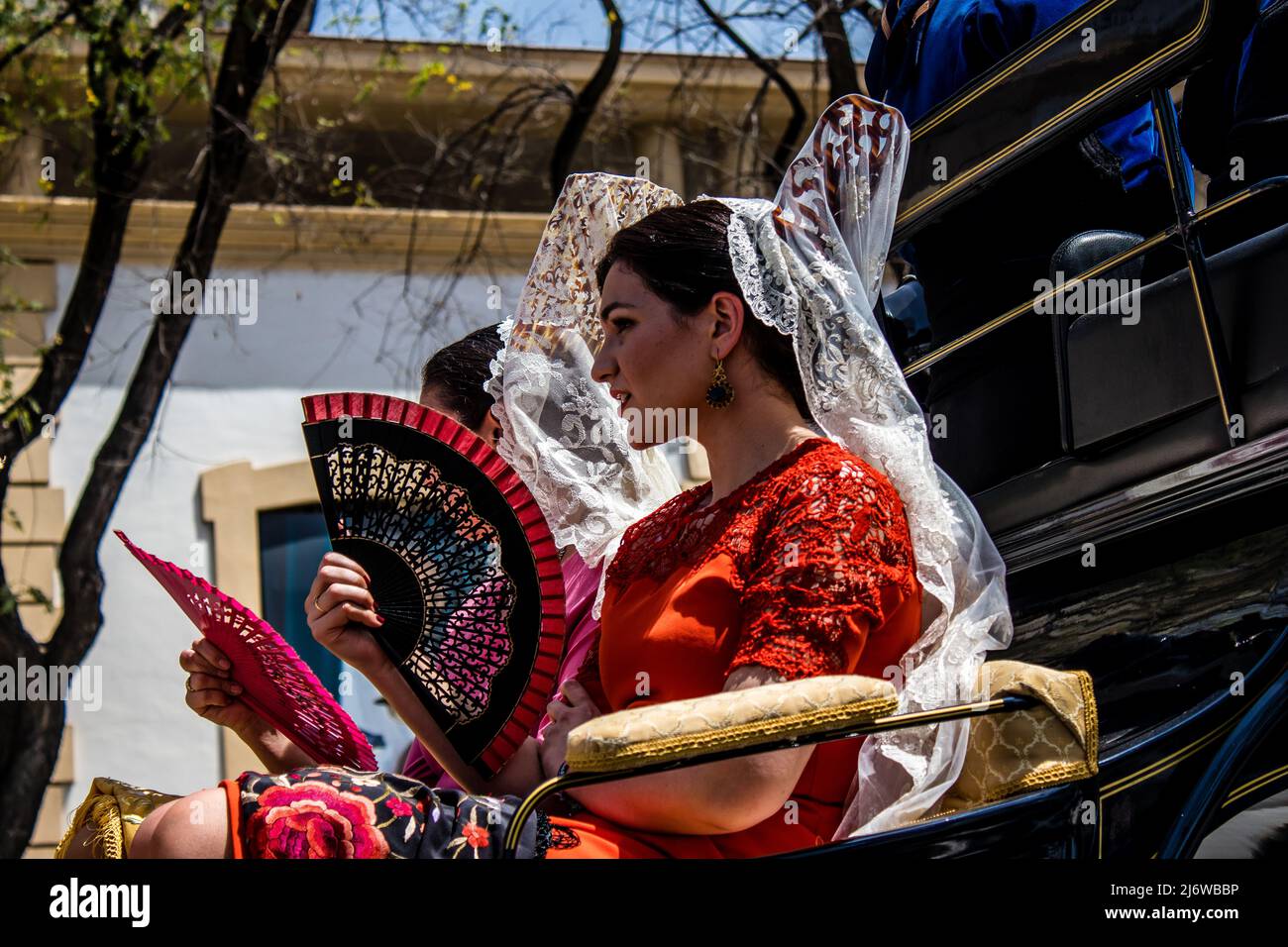 Seville, Spain- May 01, 2022 Sevillians dressed in traditional ...