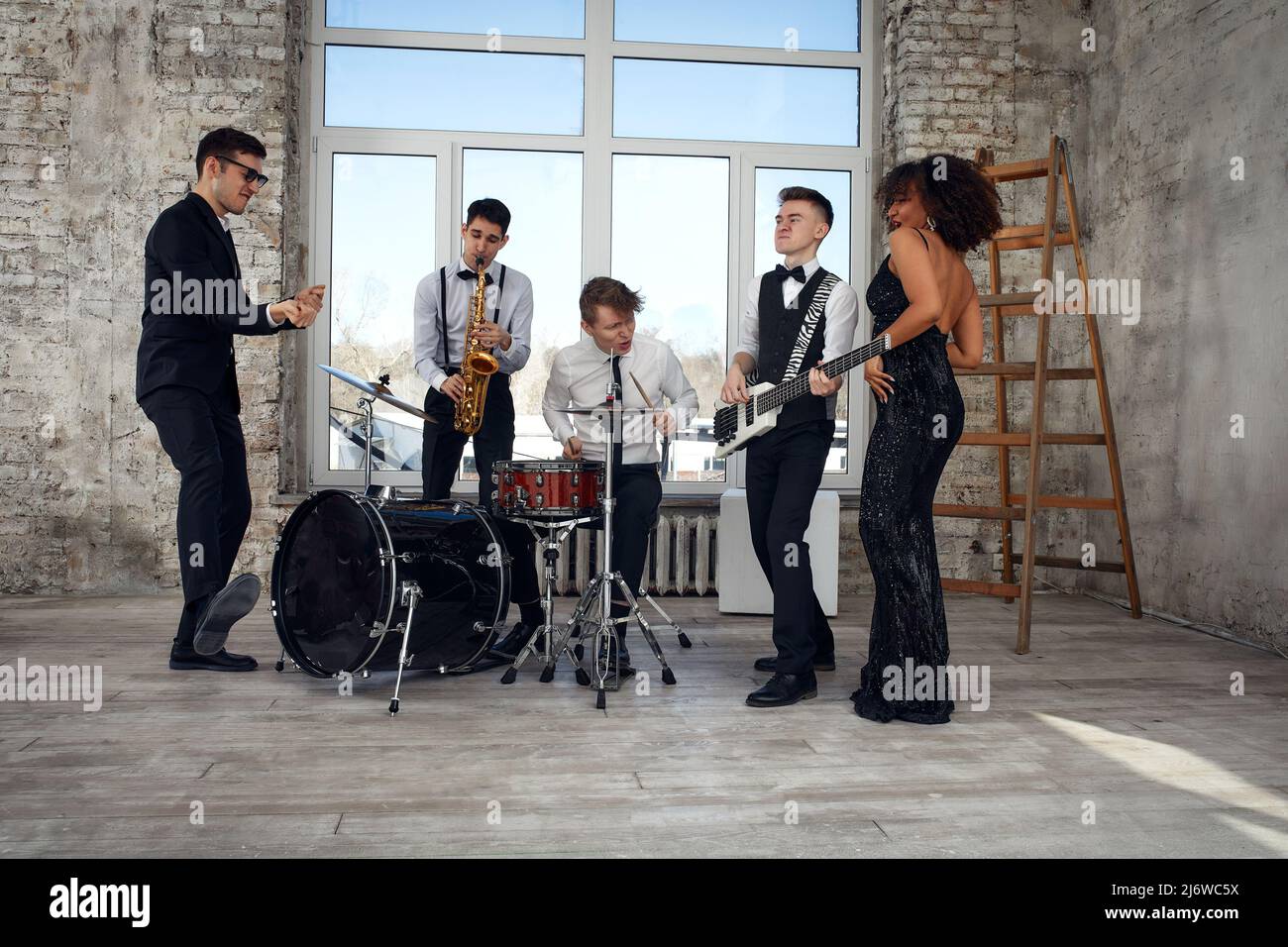 Young international musicians, a band performing on the loft stage. The ...