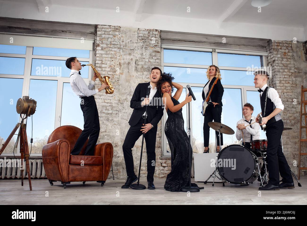 Young international musicians, a band performing on the loft stage. The ...