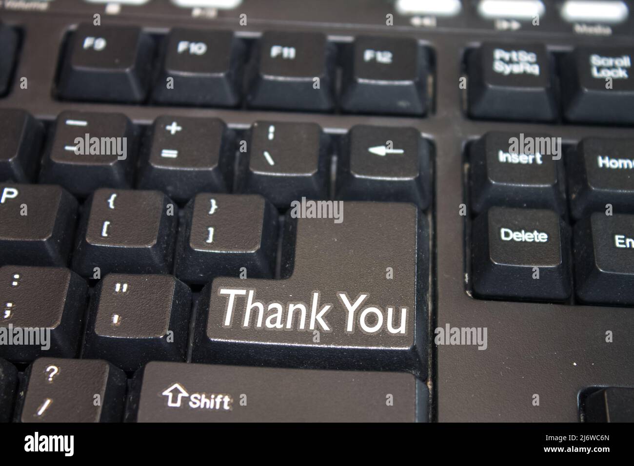 Black Computer Keyboard with Thank You text. Close-up of an electronic ...