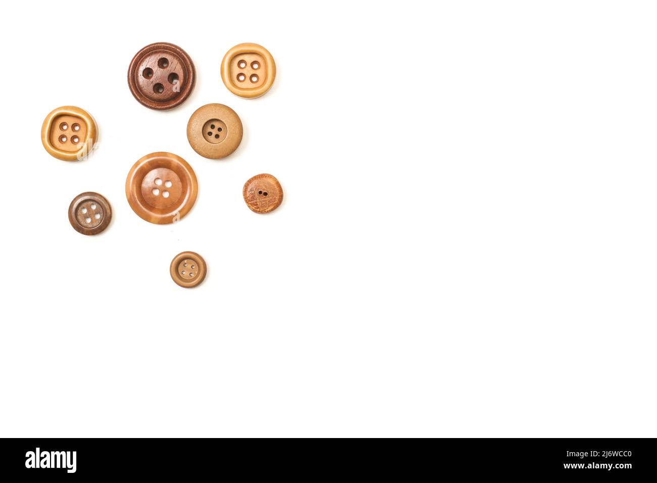 Brown sewing buttons on a white background with copy space Stock Photo ...