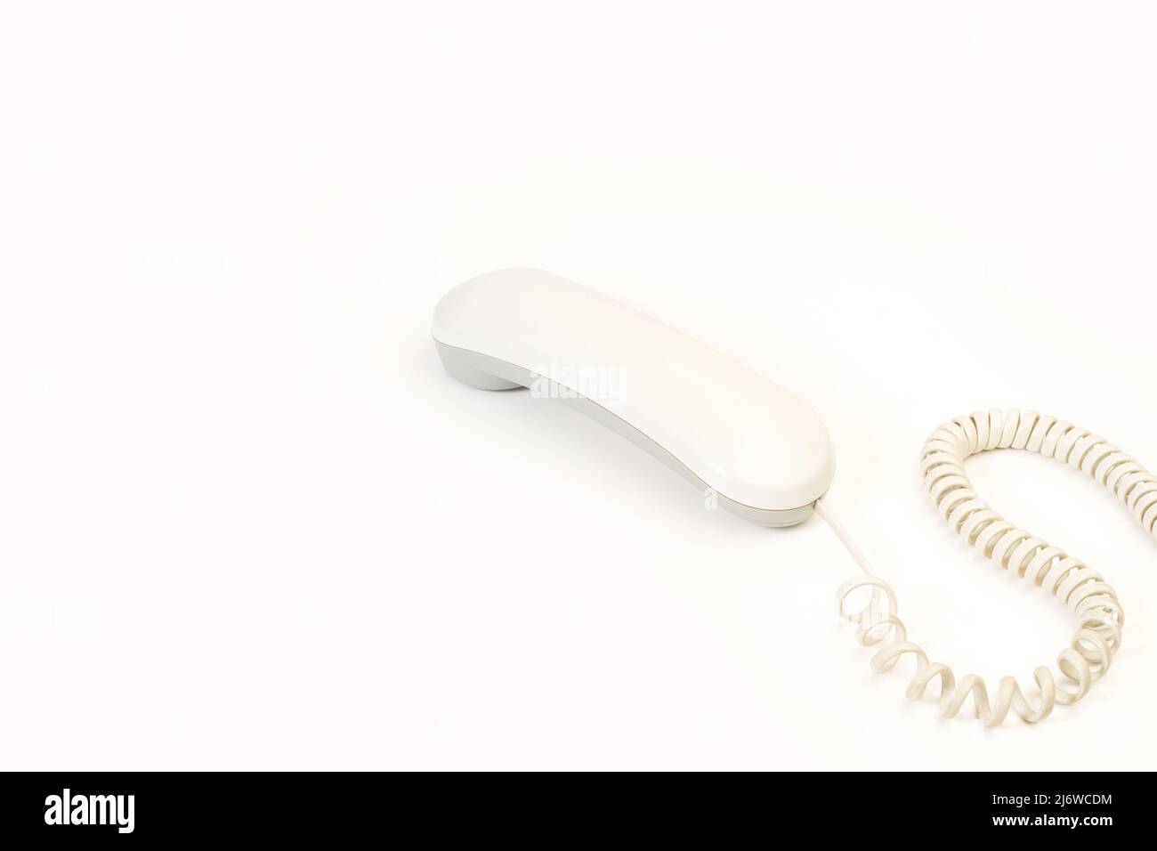 A digital telephone receiver on a white background with copy space ...