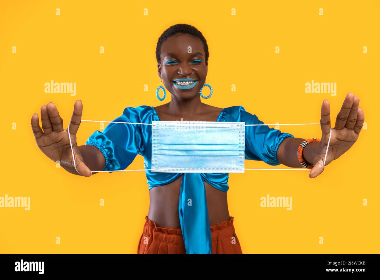 Playful african american woman showing hi-res stock photography and ...