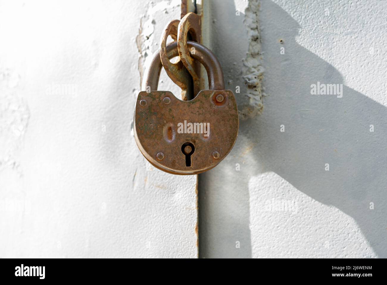The metal doors are closed with a large old metal lock Stock Photo - Alamy