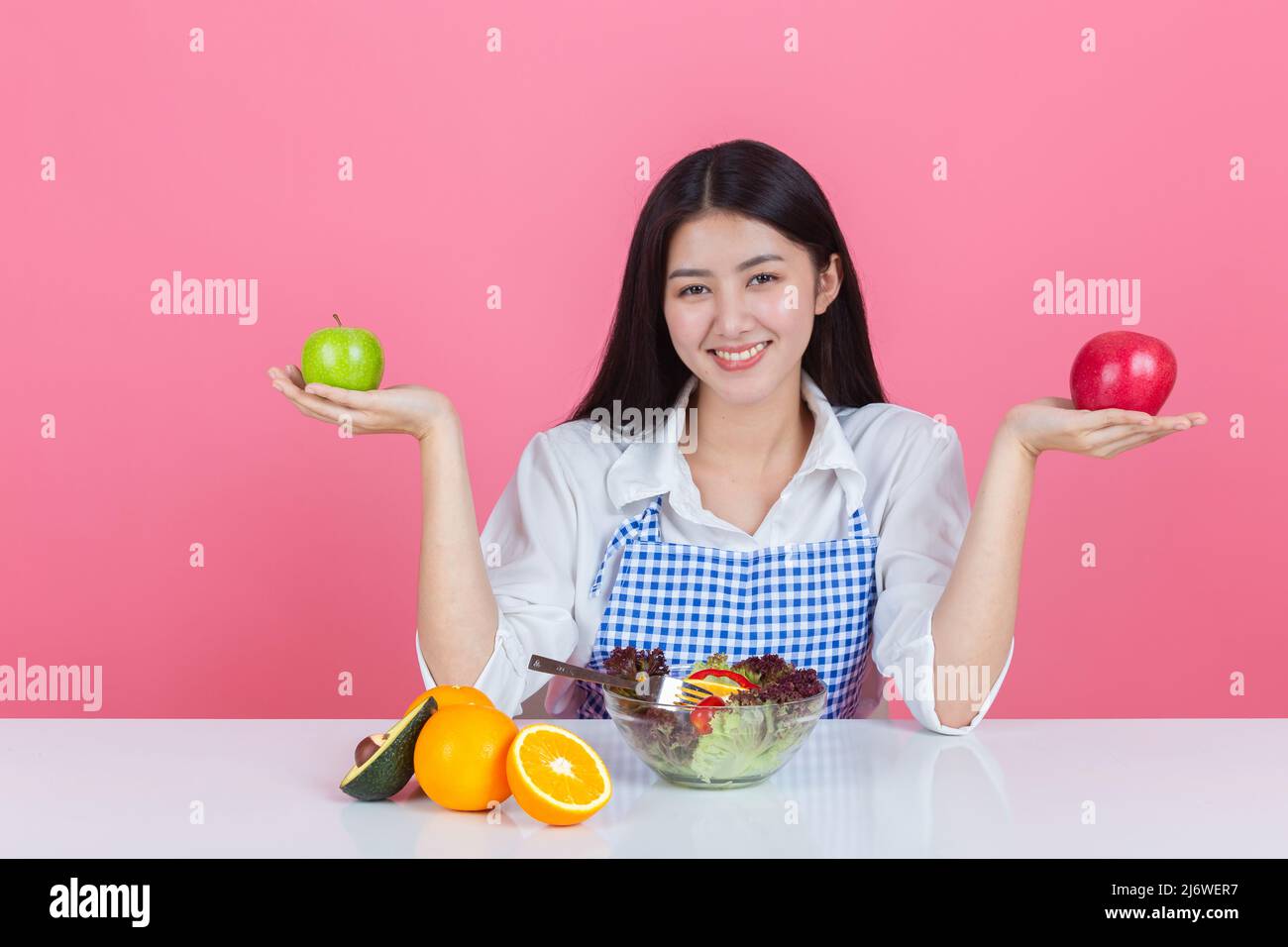 happy young asian woman choose to eat fresh orange apple fruits with ...
