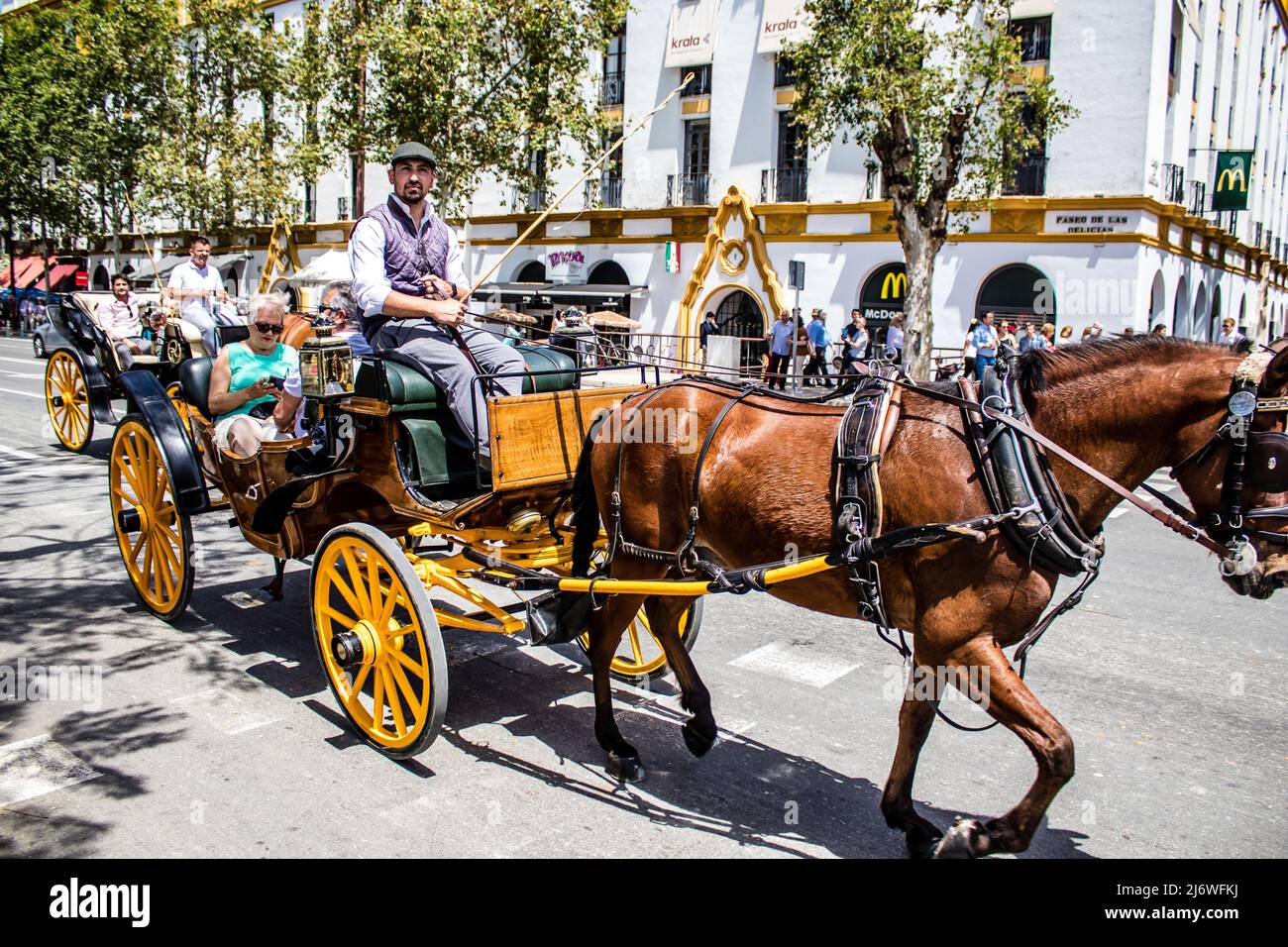 Seville, Spain- May 01, 2022 Sevillians dressed in traditional ...