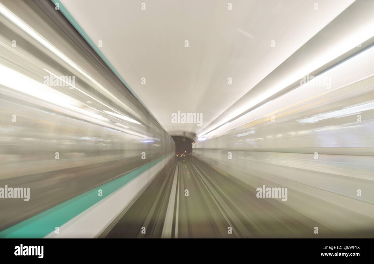 High speed train driving along the rails through a tunnel Stock Photo ...