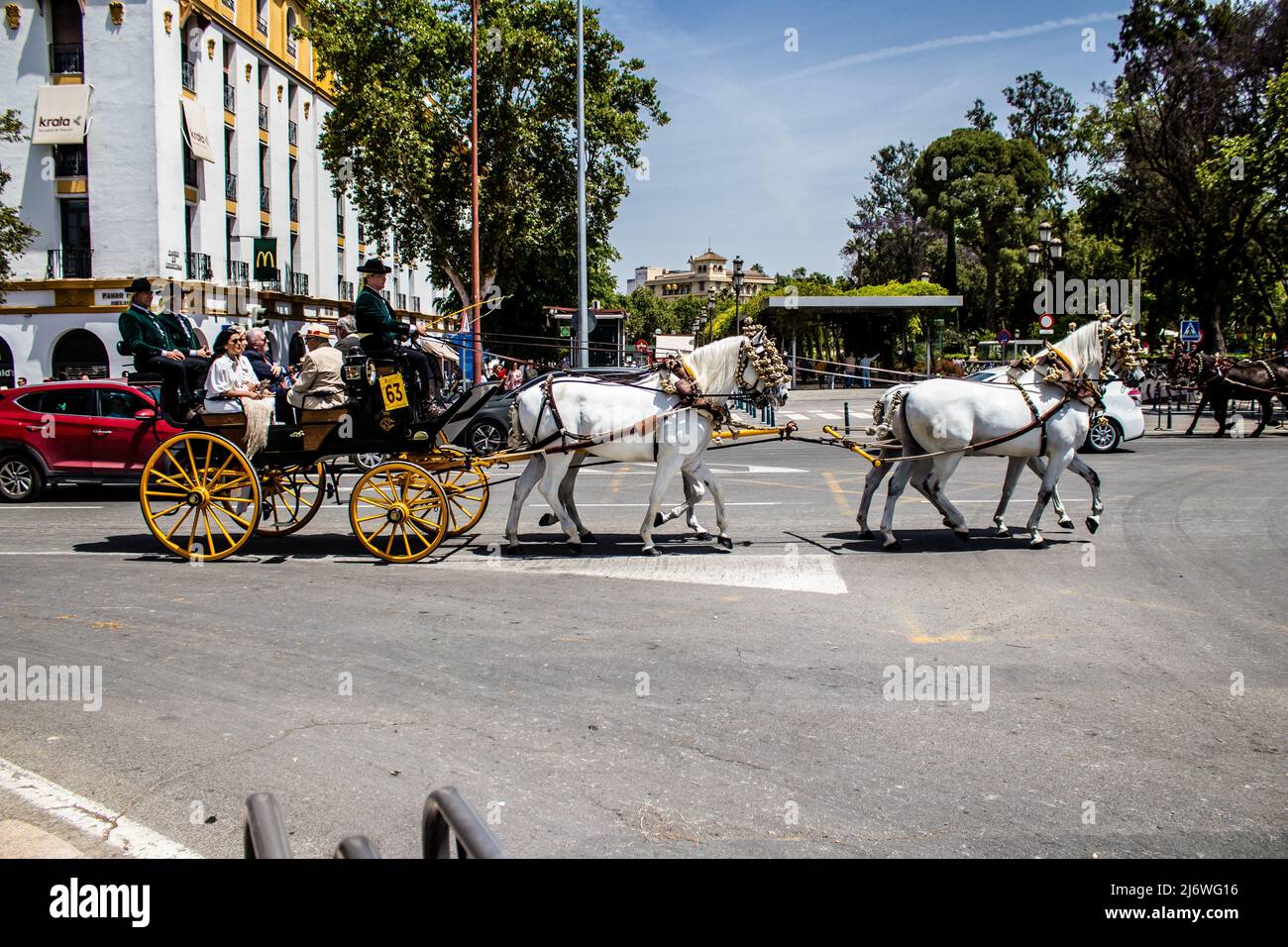 Seville, Spain- May 01, 2022 Sevillians dressed in traditional ...