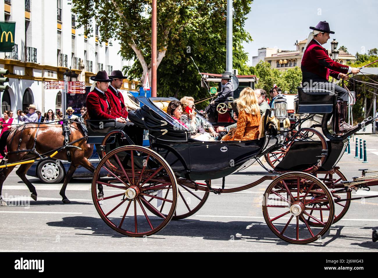 Seville, Spain- May 01, 2022 Sevillians dressed in traditional ...