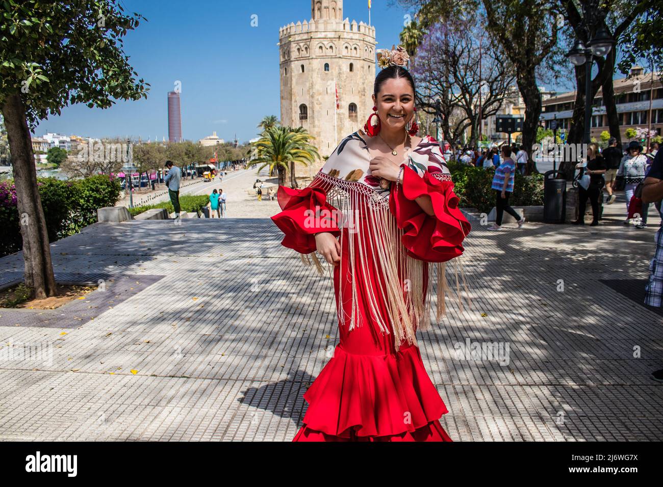 Seville, Spain - May 01, 2022 Sevillians dressed in traditional ...