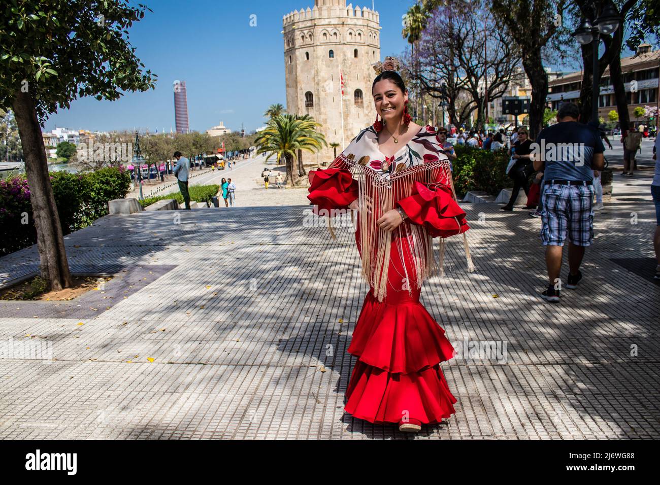Seville, Spain - May 01, 2022 Sevillians dressed in traditional ...