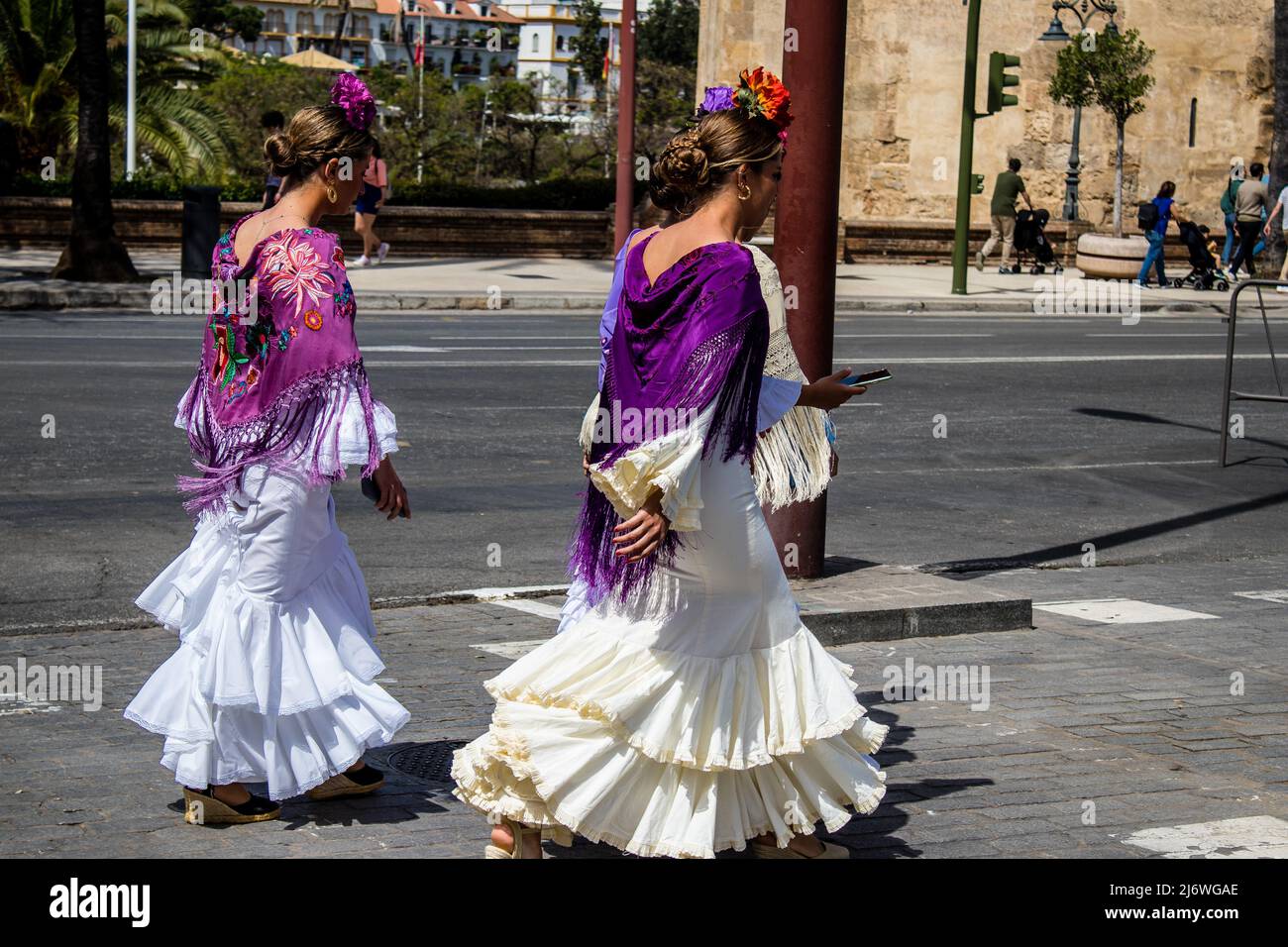 Seville, Spain - May 01, 2022 Sevillians dressed in traditional ...