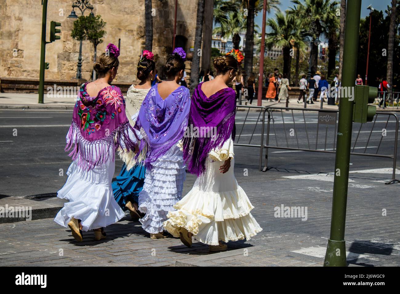 Seville, Spain - May 01, 2022 Sevillians dressed in traditional ...