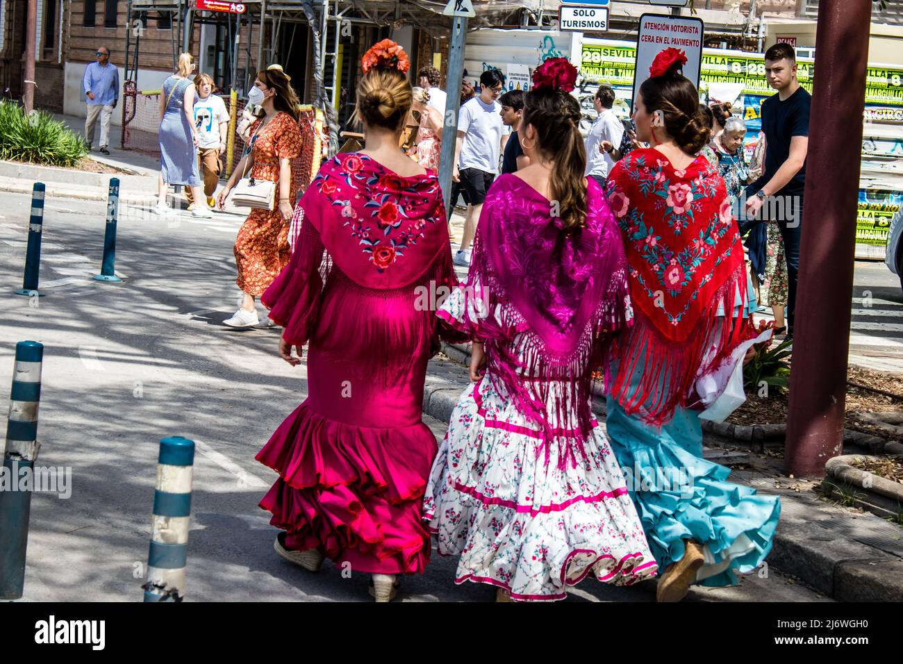 Seville, Spain - May 01, 2022 Sevillians dressed in traditional ...