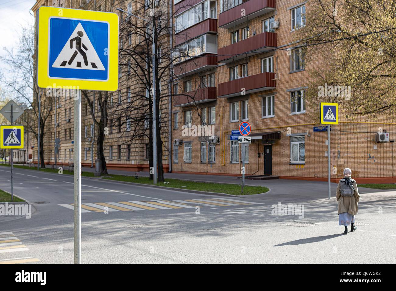 Moscow, Russia - May 01, 2022: woman crossing the road Stock Photo - Alamy