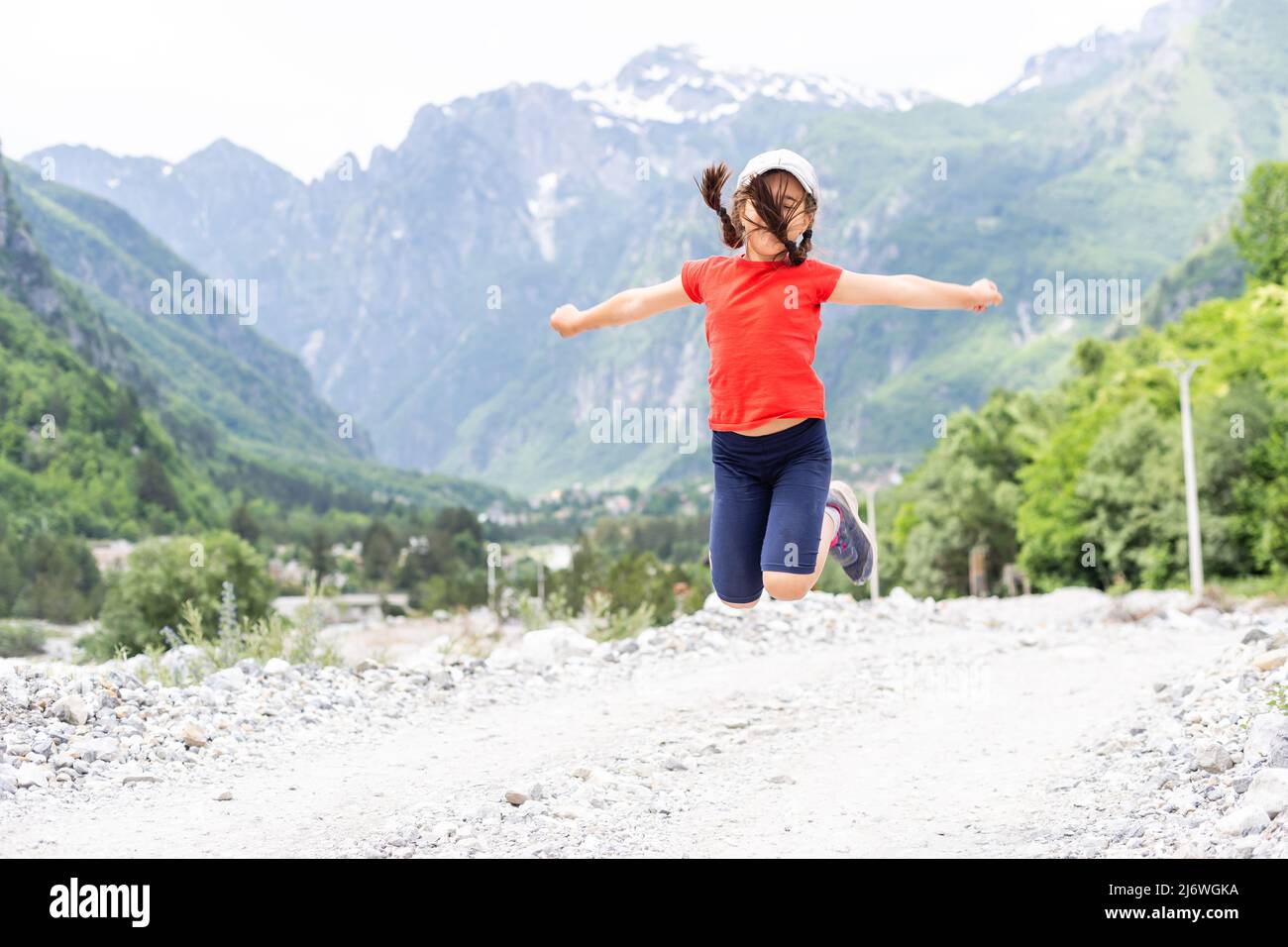 Portrait of a cute little girl in mountains Stock Photo - Alamy
