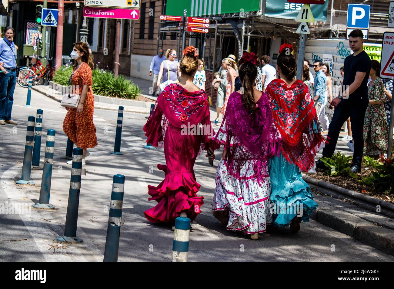 Seville, Spain - May 01, 2022 Sevillians dressed in traditional ...