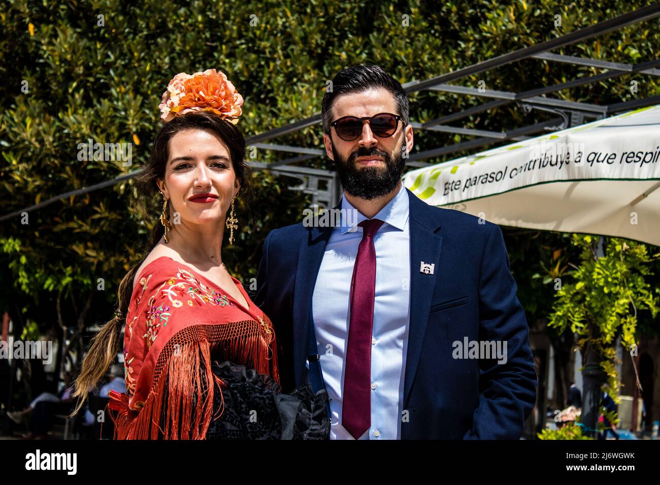Seville, Spain - May 01, 2022 Sevillians dressed in traditional ...