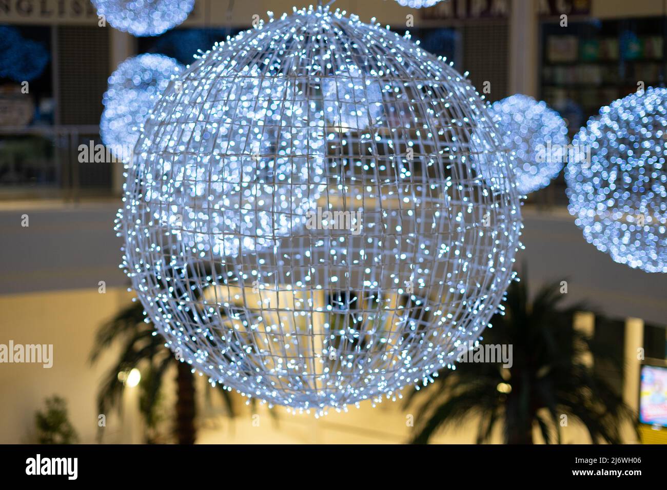 big bright balls with garlands. balls with white lights. decorations in ...