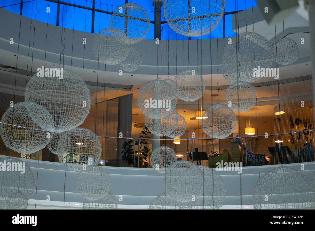 large balls with garlands off. balls under the ceiling of the mall ...