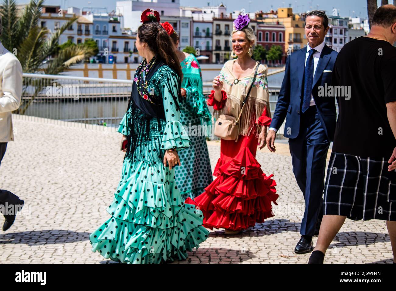 Seville, Spain - May 01, 2022 Sevillians dressed in traditional ...