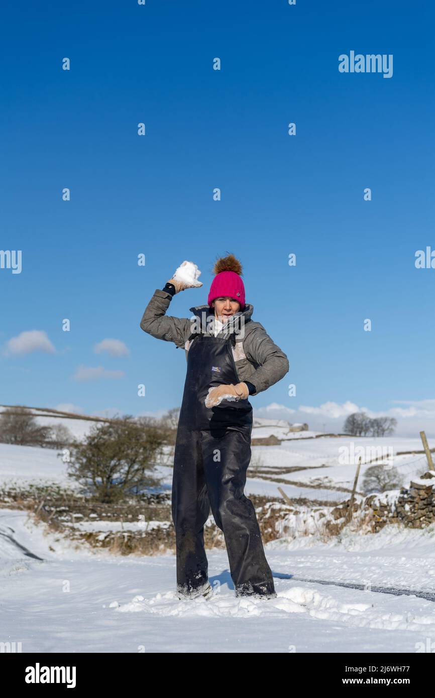 Woman throwing snowball after hi-res stock photography and images - Alamy