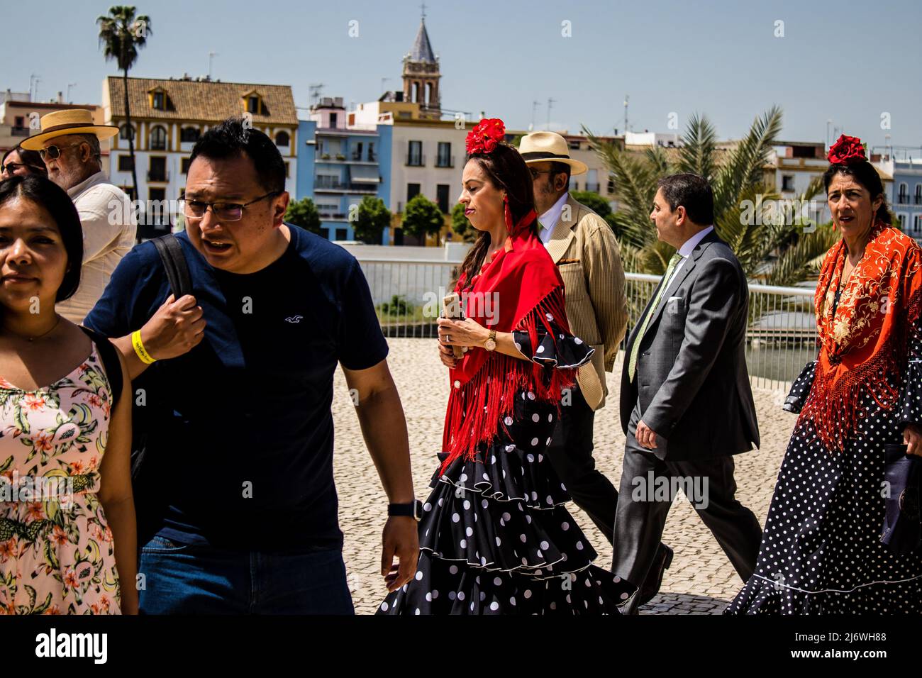 Seville, Spain - May 01, 2022 Sevillians dressed in traditional ...