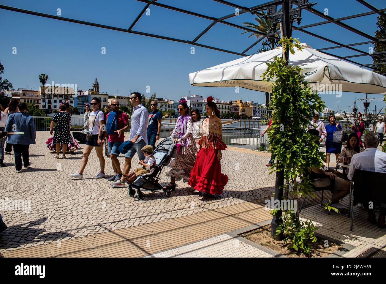 Seville, Spain - May 01, 2022 Sevillians dressed in traditional ...