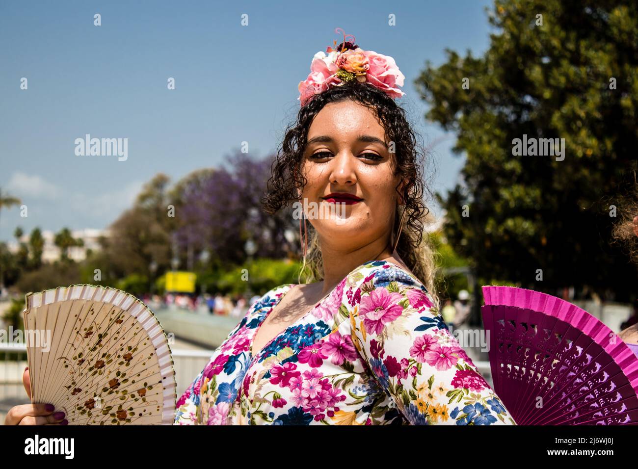 Seville, Spain - May 01, 2022 Sevillians dressed in traditional ...