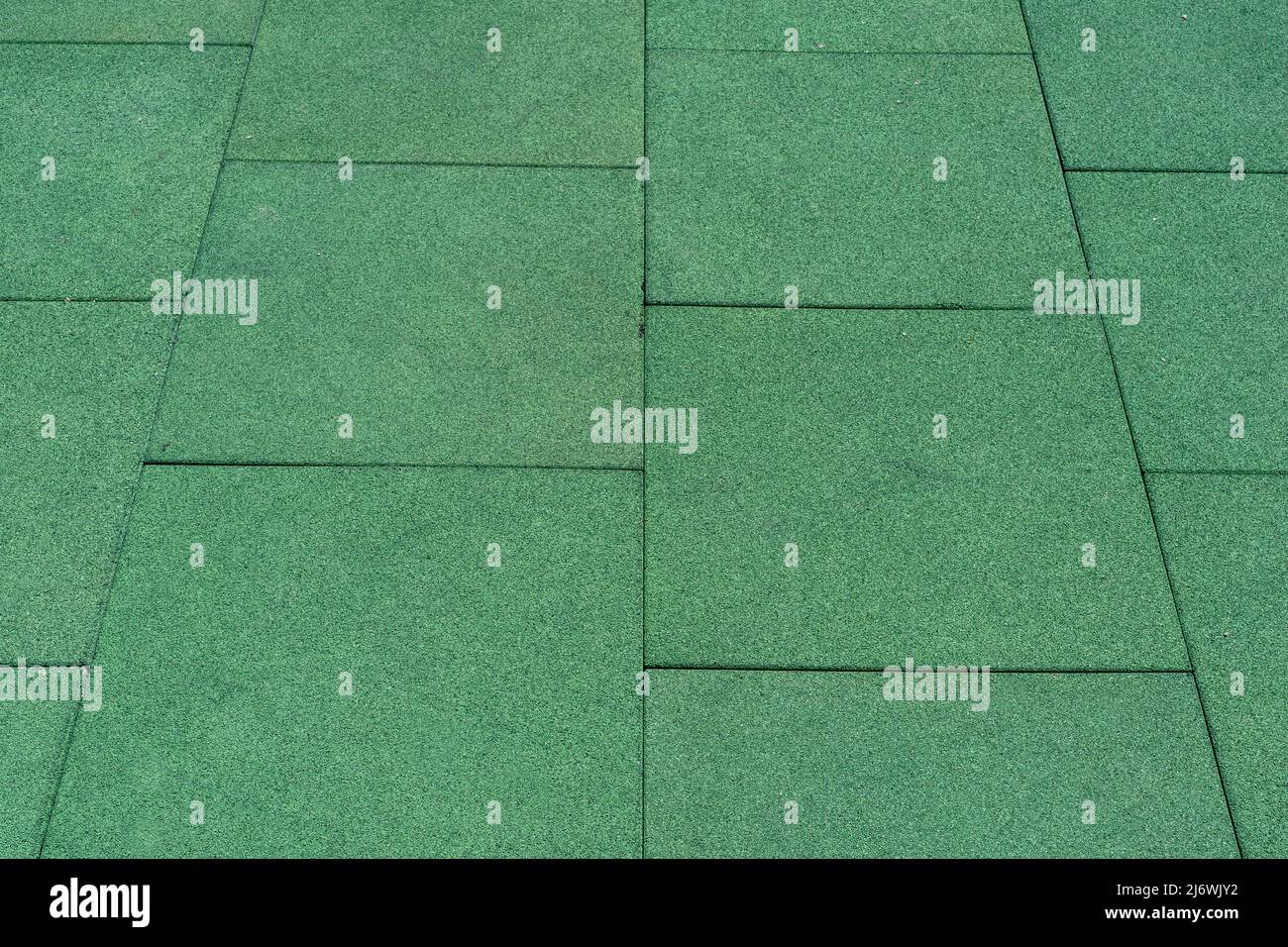 Green tile floor. Floor coverings. Large floor tiles Stock Photo - Alamy